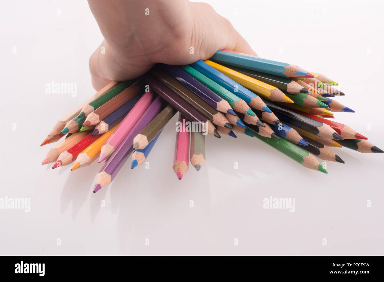 Hand holding Color pencils on a white background Stock Photo - Alamy