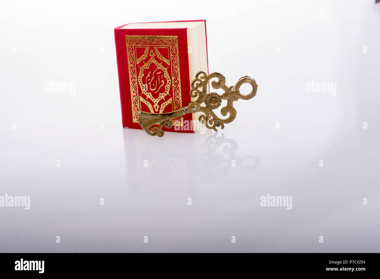 Retro Key and Islamic Holy Book Quran in mini size Stock Photo - Alamy