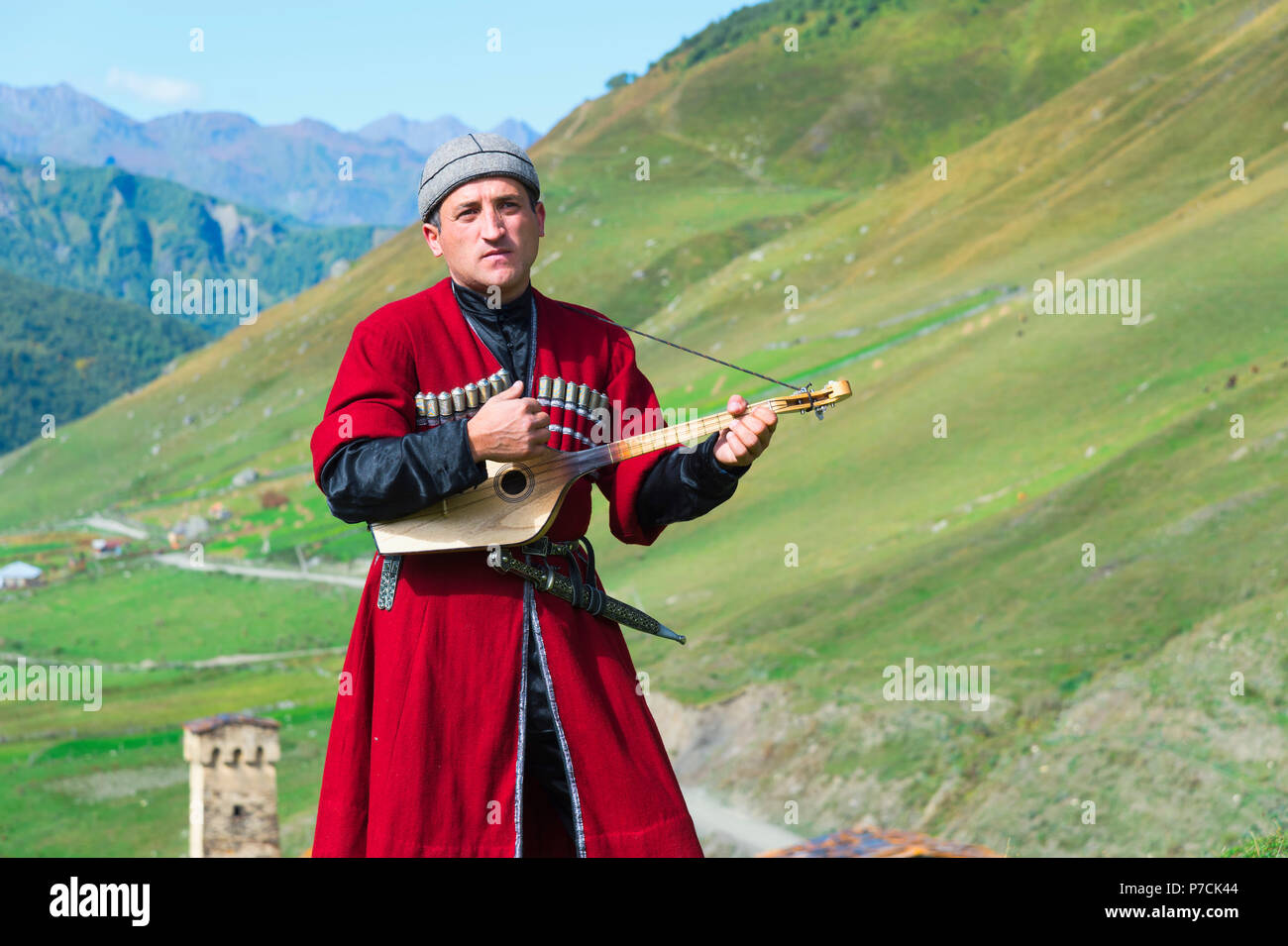 Georgian musician of a folkloric group playing Panduri, For editorial ...