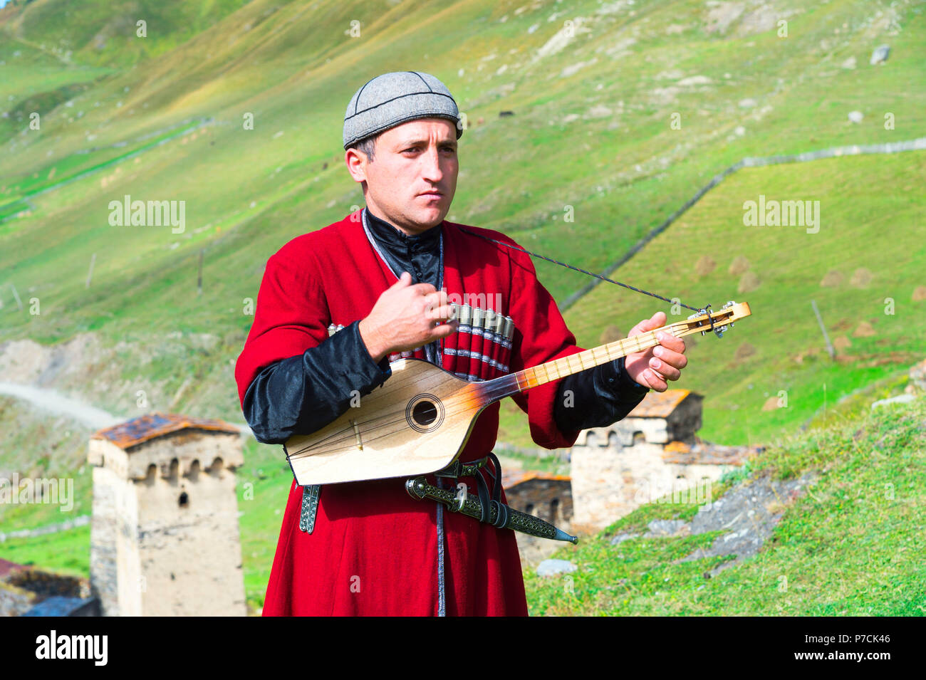 Georgian musician of a folkloric group playing Panduri, For editorial ...