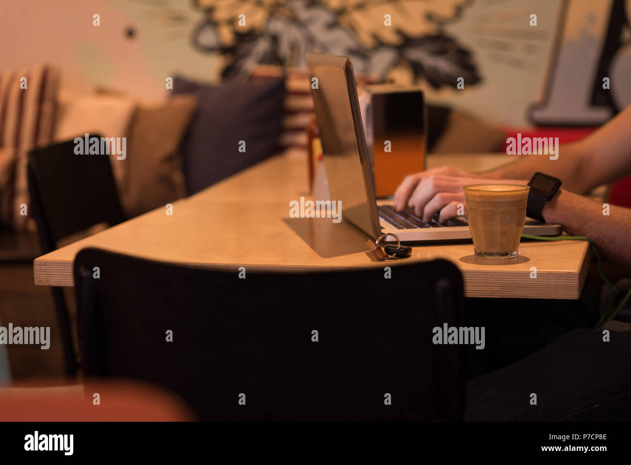 Man using laptop in cafe Stock Photo - Alamy