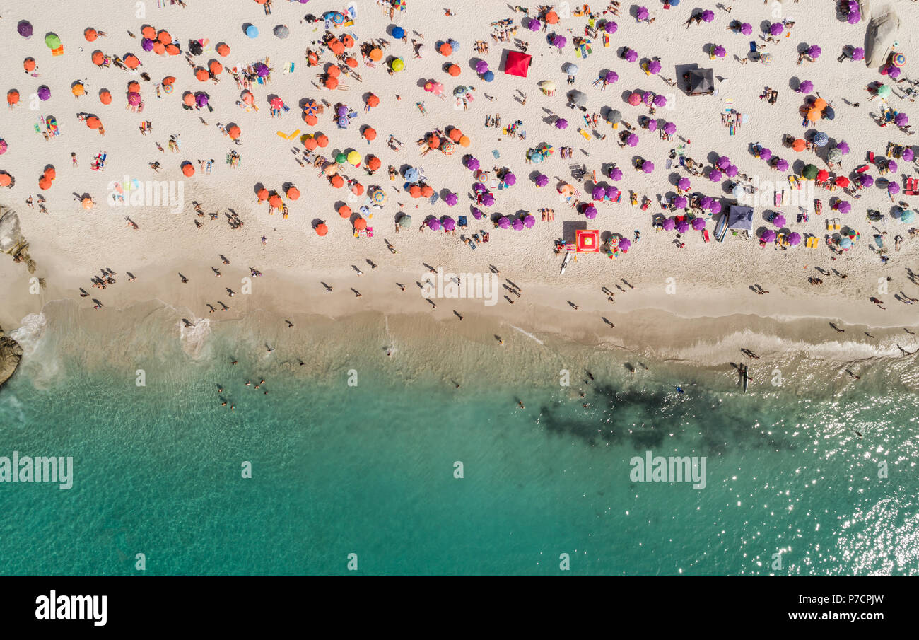 Tourist sunbathing at beach on a sunny day Stock Photo - Alamy