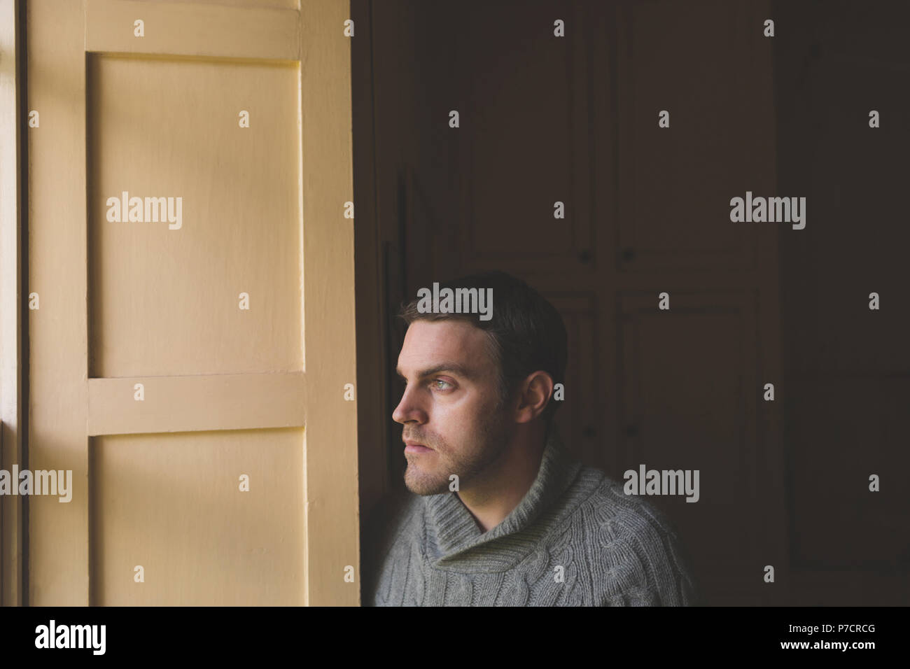Man apartment window hi-res stock photography and images - Alamy