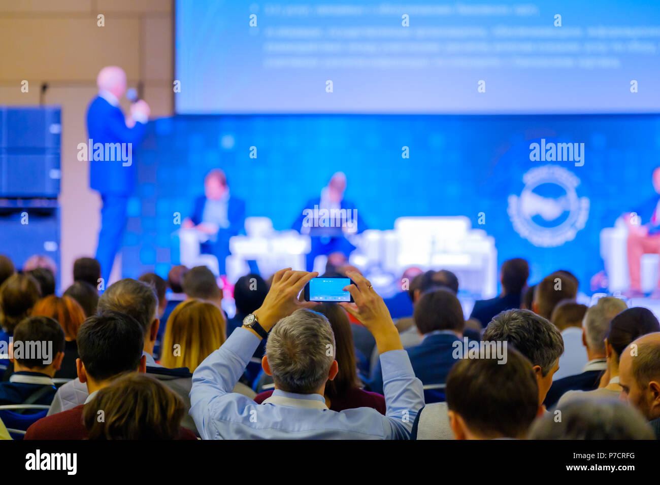 People attend business conference in the congress hall Stock Photo - Alamy
