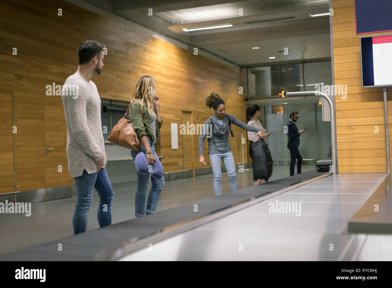 Airport carousel woman hi-res stock photography and images - Alamy