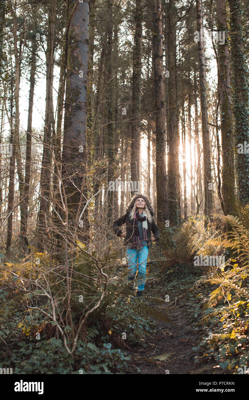 Woman walking in forest hi-res stock photography and images - Alamy