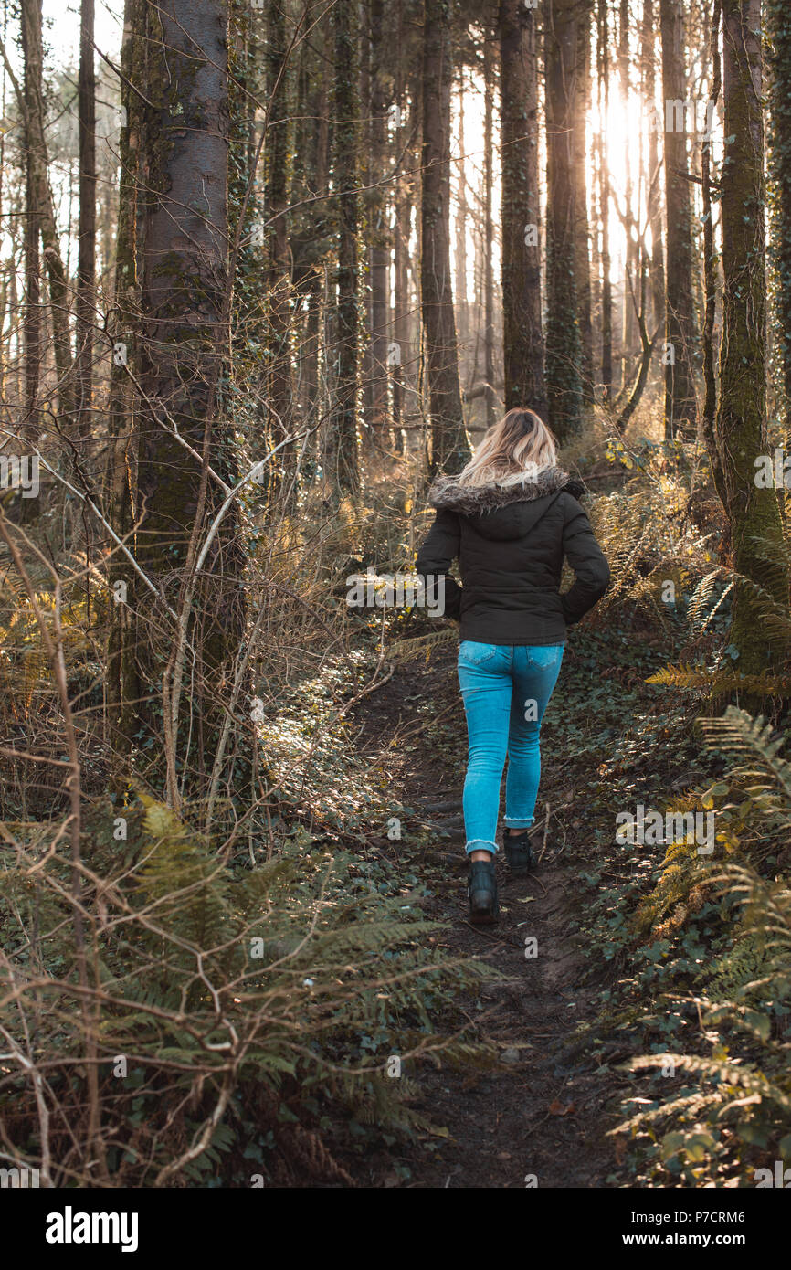 Female walking alone in a forest hi-res stock photography and images ...
