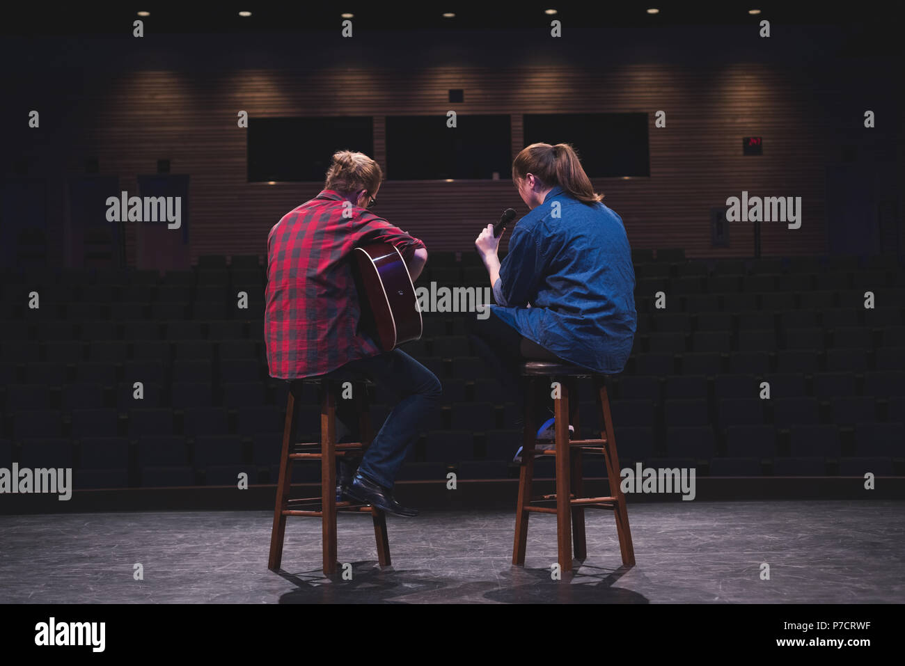 Singer and musician performing on stage Stock Photo - Alamy