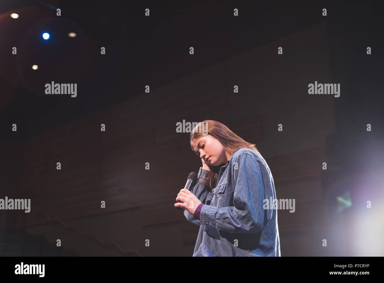 Female singer performing on stage Stock Photo - Alamy