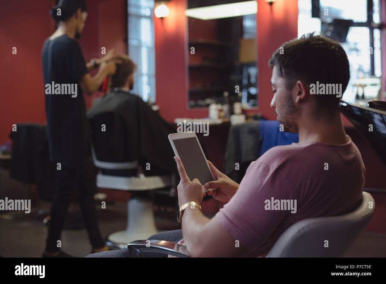 Male customer using digital tablet Stock Photo - Alamy