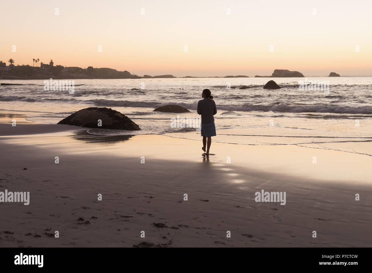 Silhouette of woman walking at dusk hi-res stock photography and images ...