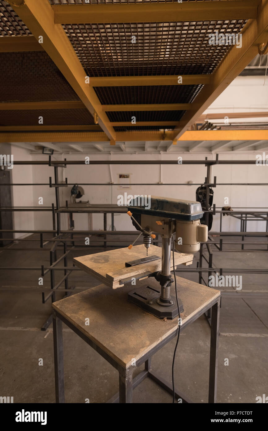Vertical drilling machine on a table Stock Photo - Alamy