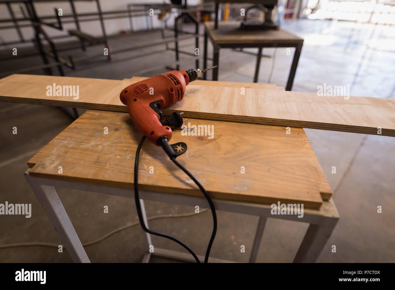 Drilling machine on a table Stock Photo - Alamy
