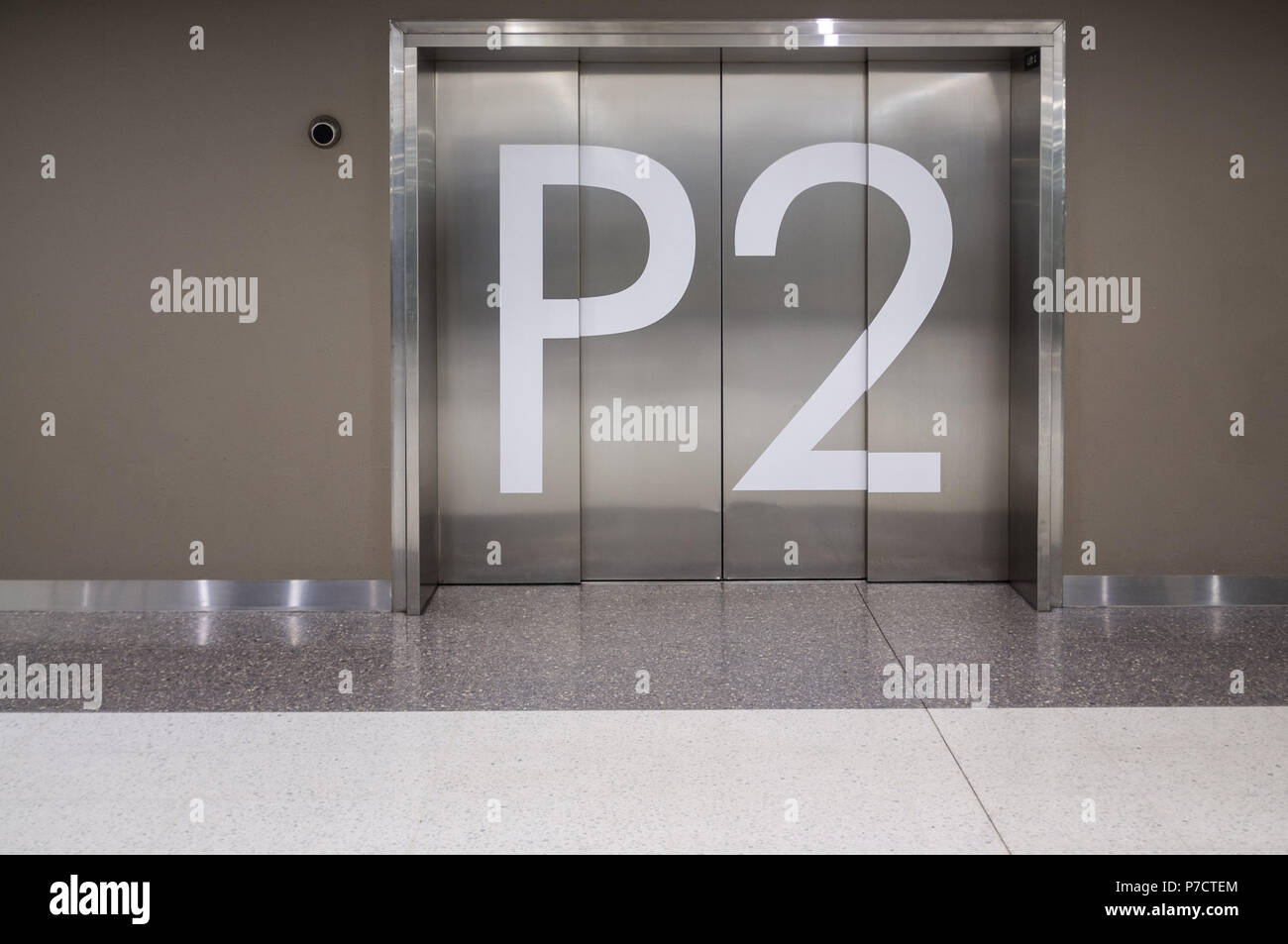 Elevator doors on parking underground level 2 floor of public building ...