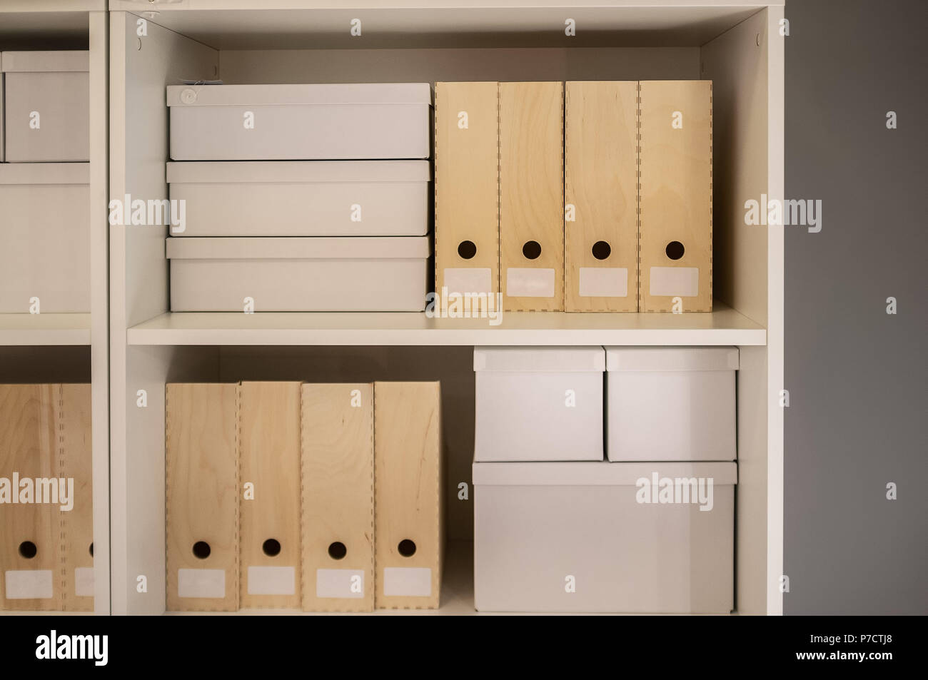 Document archive folders and white boxes on wooden shelves Stock Photo ...