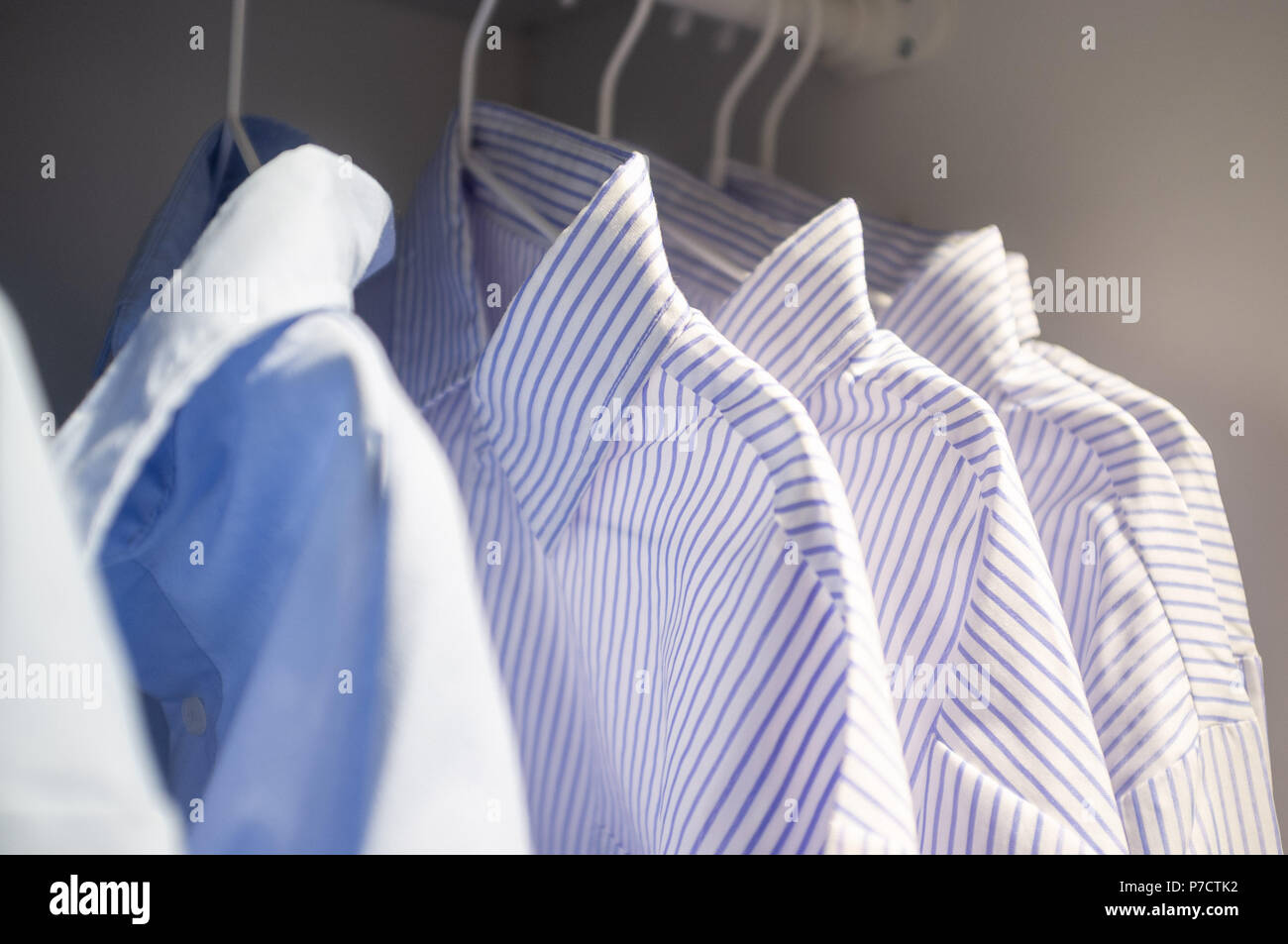 Row of clothes in a closet hi-res stock photography and images - Alamy