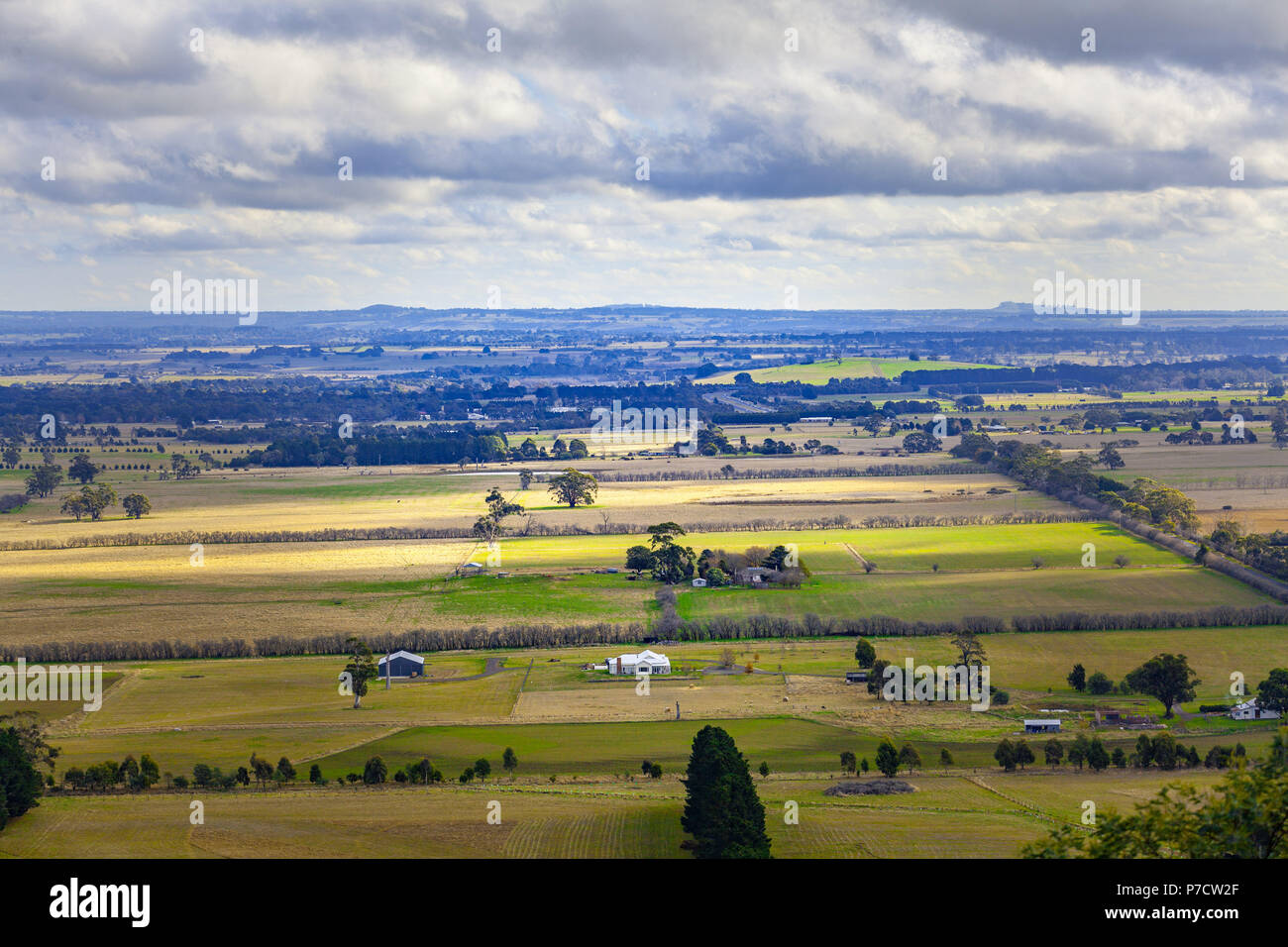 Rural landscape in Australia - green fields and hills under cloudy sky ...