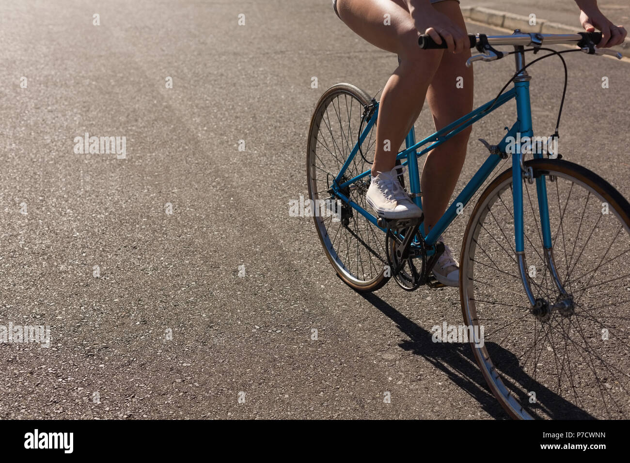 Woman riding a bicycle hi-res stock photography and images - Alamy