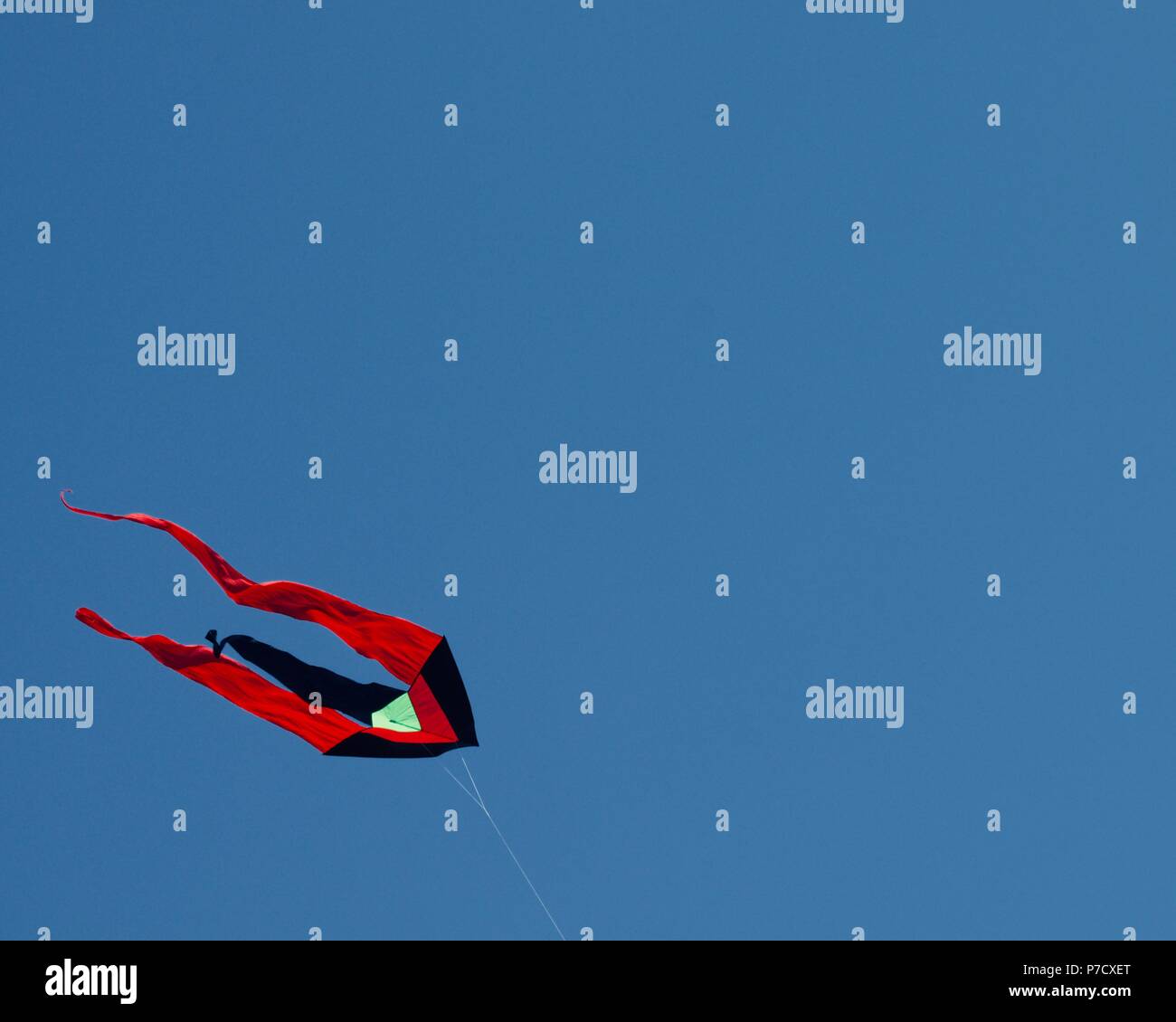 Kite flying isolated blue hi-res stock photography and images - Alamy