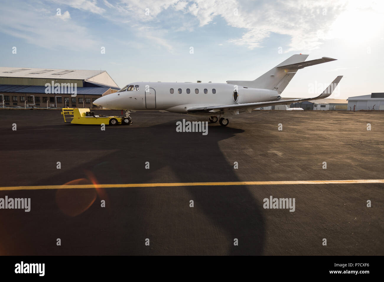 Private jet with trolley at terminal Stock Photo - Alamy
