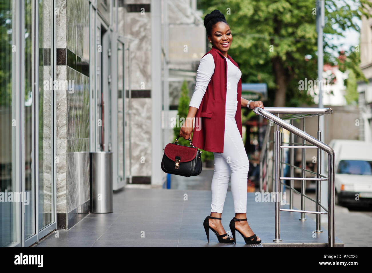 African american girl with hand bag posed outdoor of steets city Stock ...