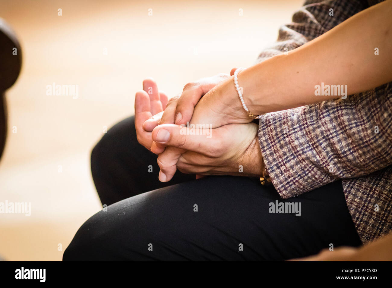 hands intertwined wedding couple on wedding day Stock Photo - Alamy