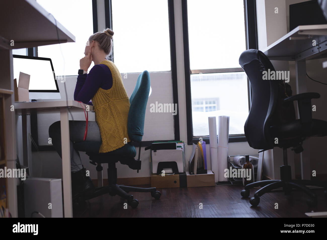 Female executive working on computer at desk Stock Photo - Alamy