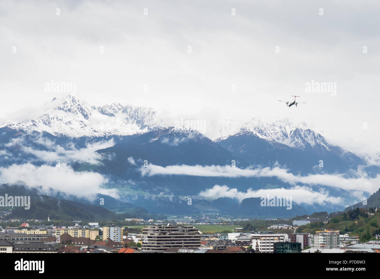 Plane flying over Snowy mountains in the Alps near Innsbruck Stock ...