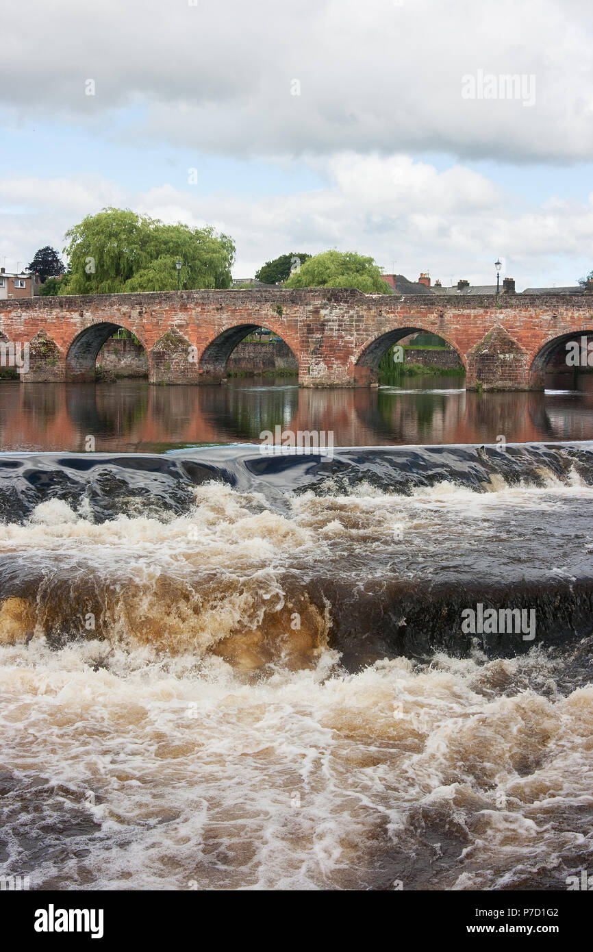 Devogilla Bridge (15th century) over the river Nith with weir in ...