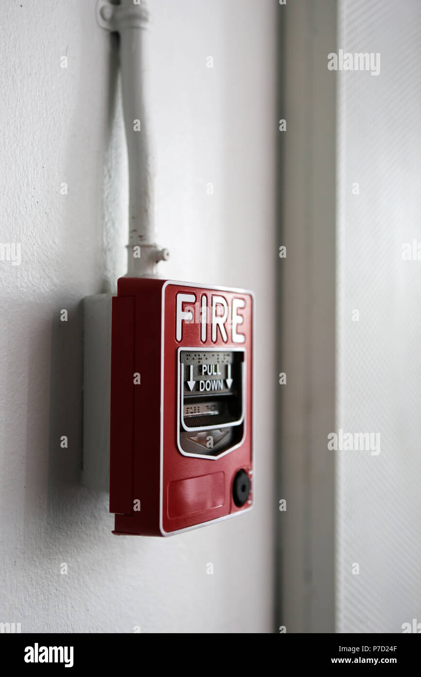 fire alarm switch attached on the white wall Stock Photo - Alamy