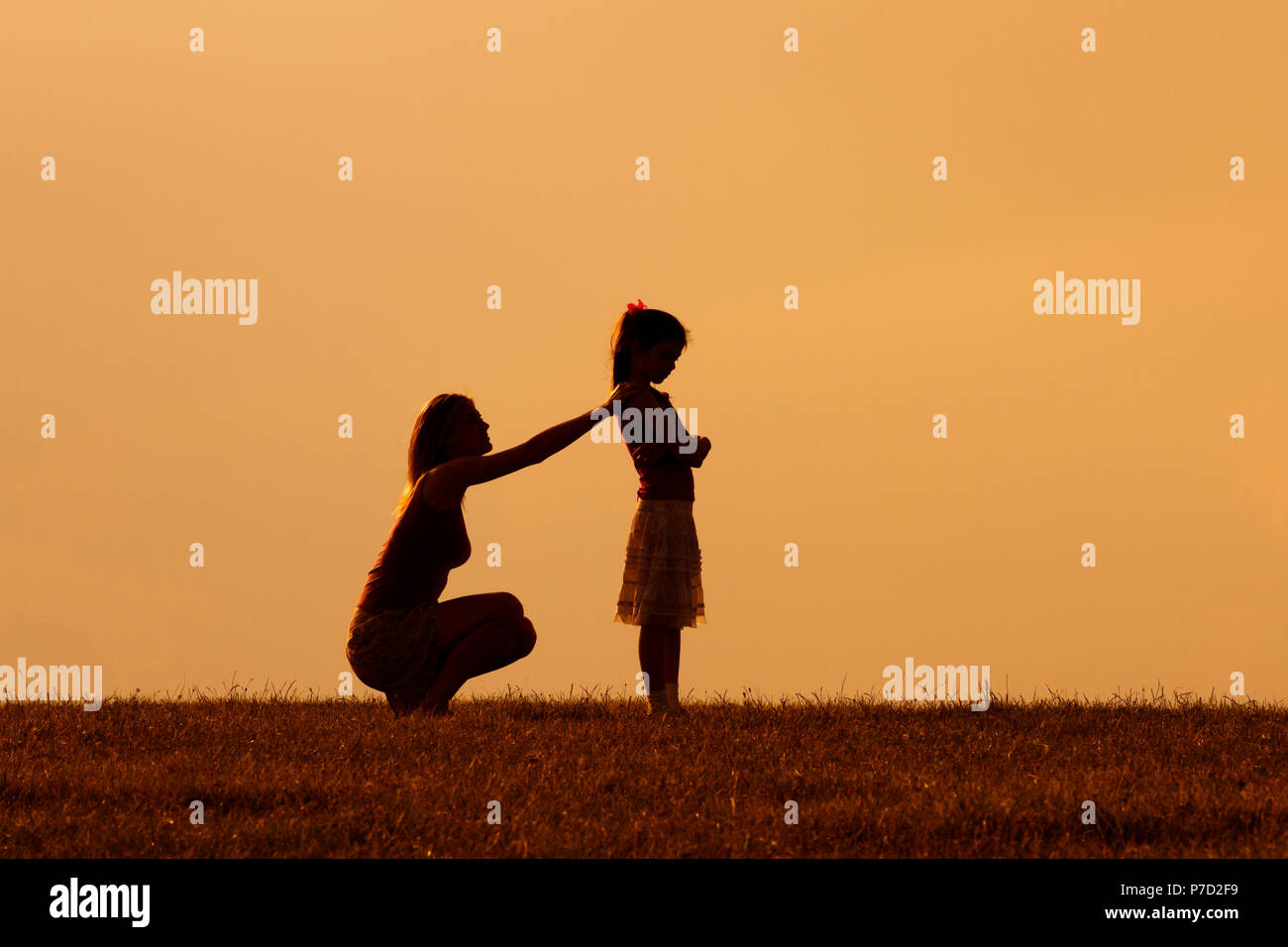 Mother and daughter had a conflict and now mother consoling her angry ...