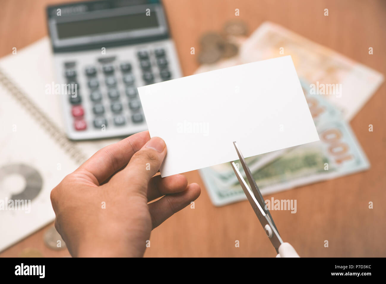 Hands scissors cutting money hi-res stock photography and images - Alamy