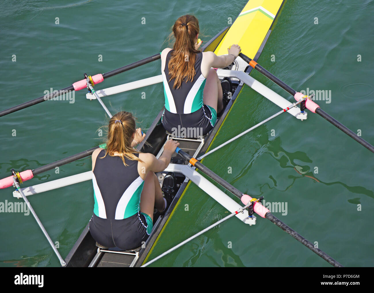 Two young women paddle boat hi-res stock photography and images - Alamy