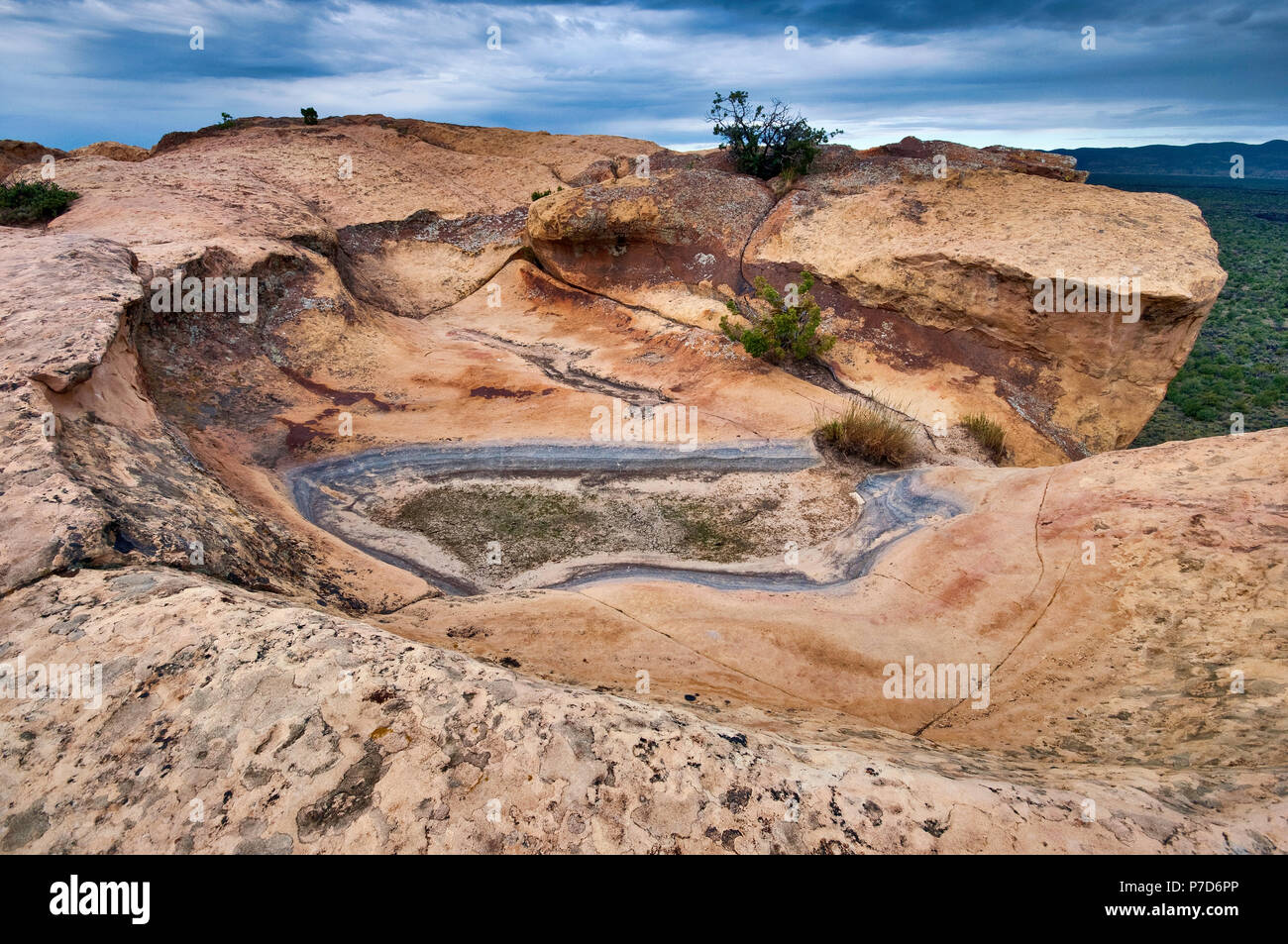 Dry tinaja (pothole) at Sandstone Bluffs at El Malpais National ...