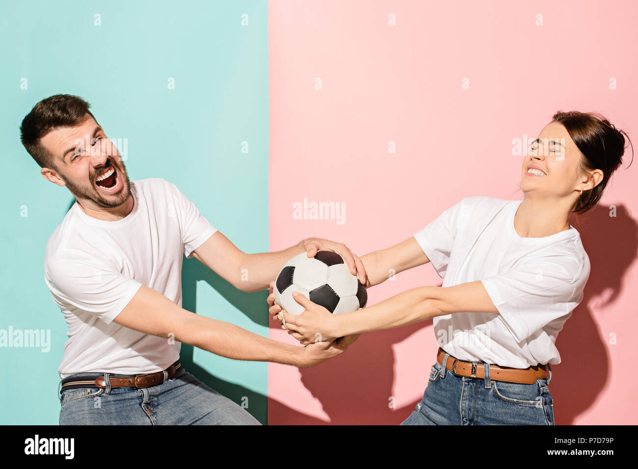 The unhappy and angry fans on colored blue and pink background Stock ...