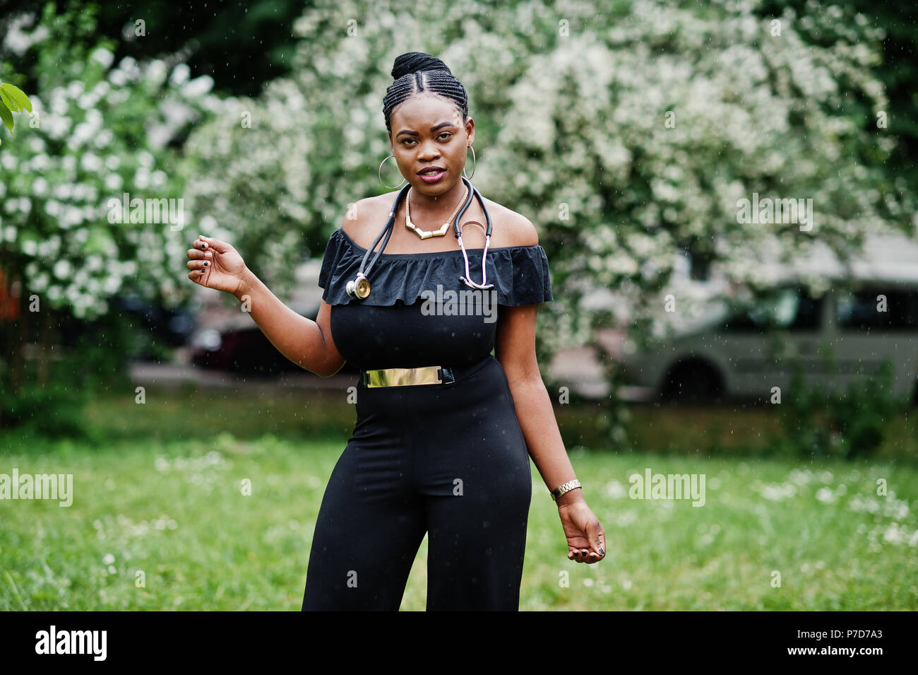 African american doctor female at black dress with stethoscope posed ...