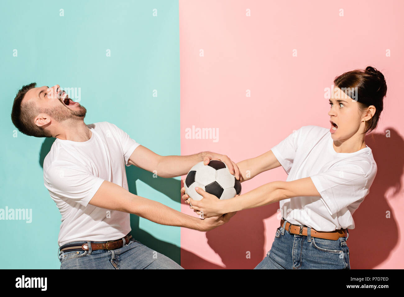 The unhappy and angry fans on colored blue and pink background Stock ...