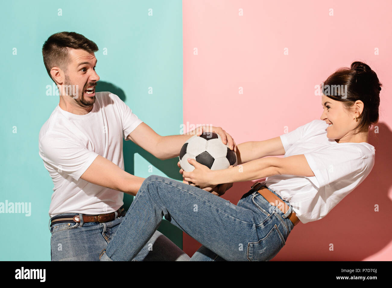 The unhappy and angry fans on colored blue and pink background Stock ...