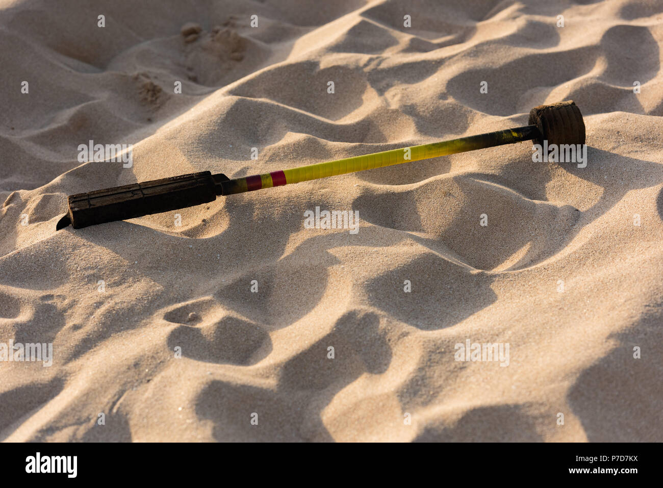 Fire levi stick on the beach Stock Photo - Alamy