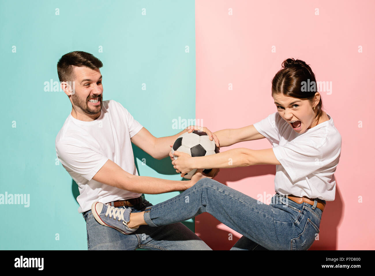 The unhappy and angry fans on colored blue and pink background Stock ...