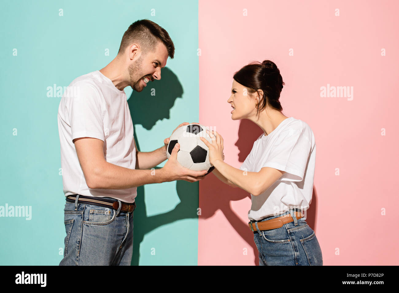 The unhappy and angry fans on colored blue and pink background Stock ...