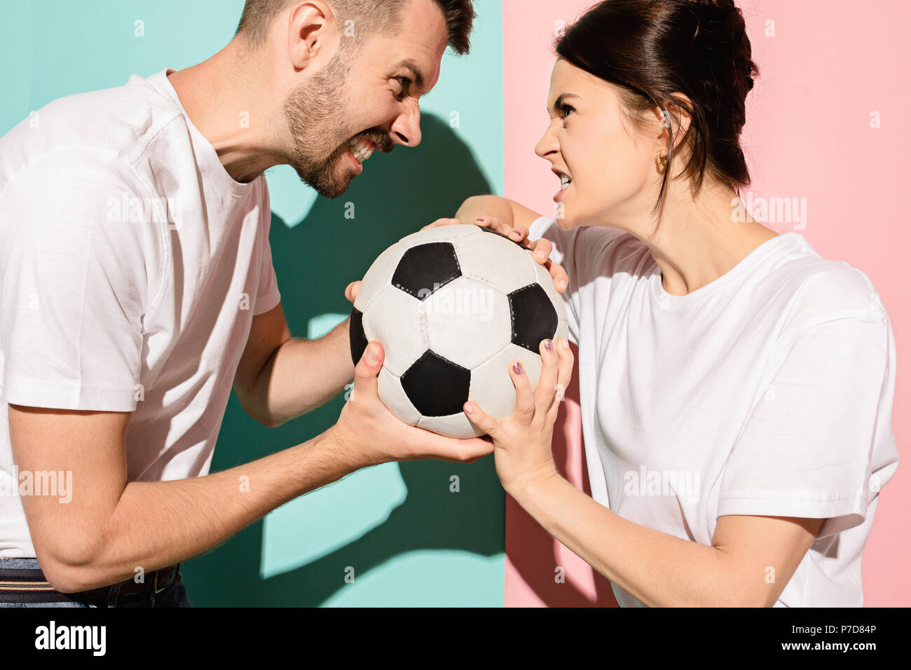 The unhappy and angry fans on colored blue and pink background Stock ...