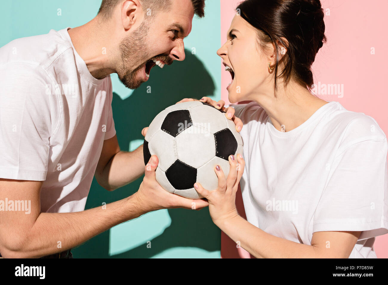 The unhappy and angry fans on colored blue and pink background Stock ...