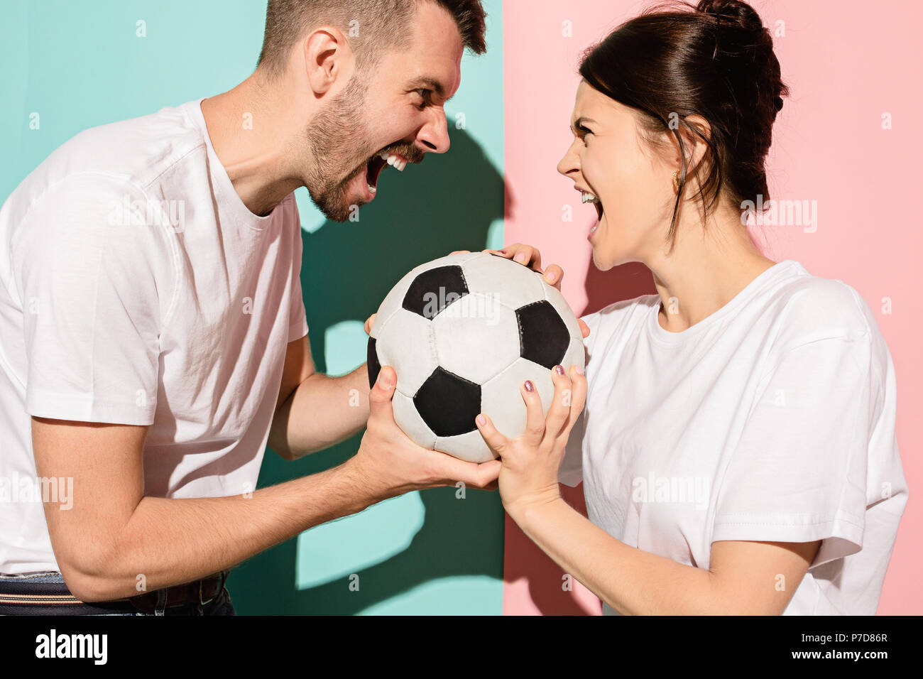 The unhappy and angry fans on colored blue and pink background Stock ...