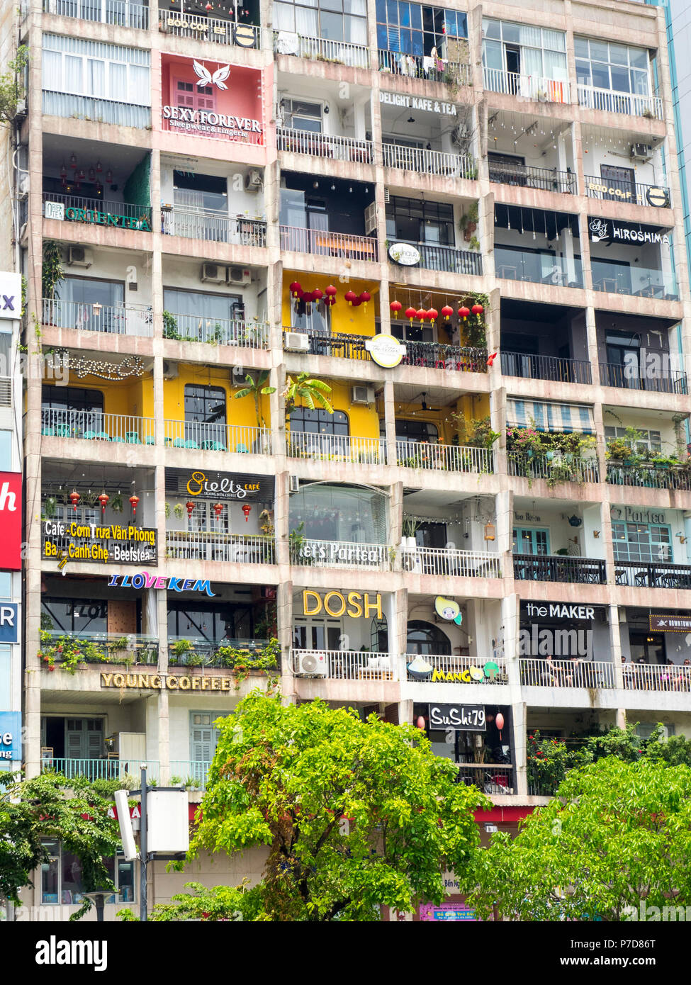 Facade of a tower of coffee shops and boutiques on Nguyen Hue Walking ...