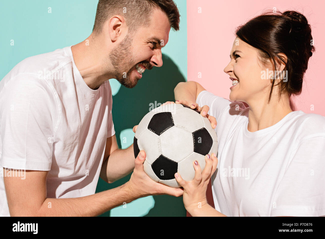 The unhappy and angry fans on colored blue and pink background Stock ...