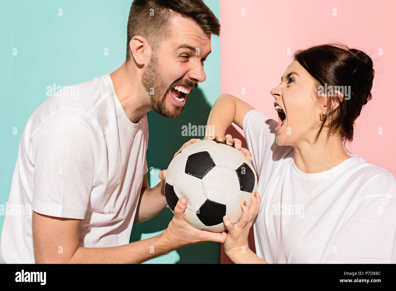 The unhappy and angry fans on colored blue and pink background Stock ...