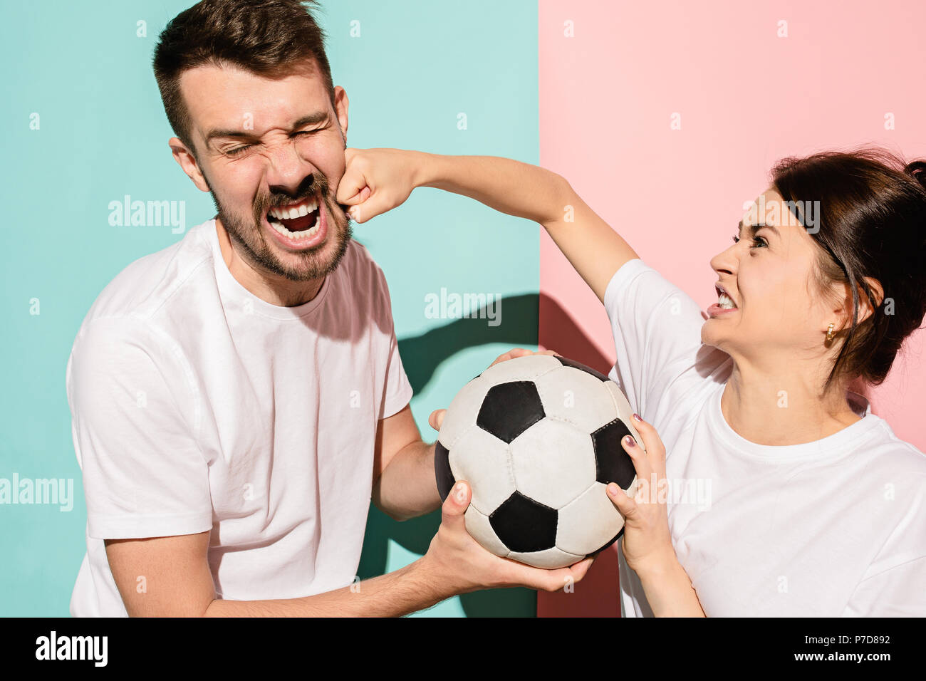 The unhappy and angry fans on colored blue and pink background Stock ...