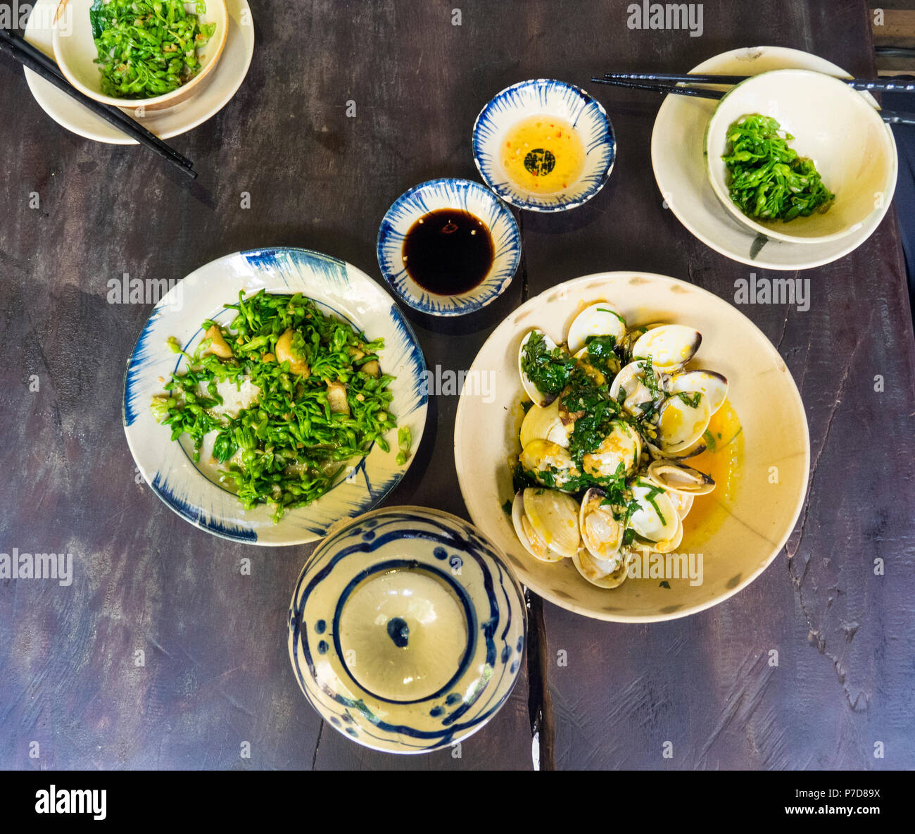 Vietnamese cuisine, green vegetales and cockle shells Stock Photo - Alamy