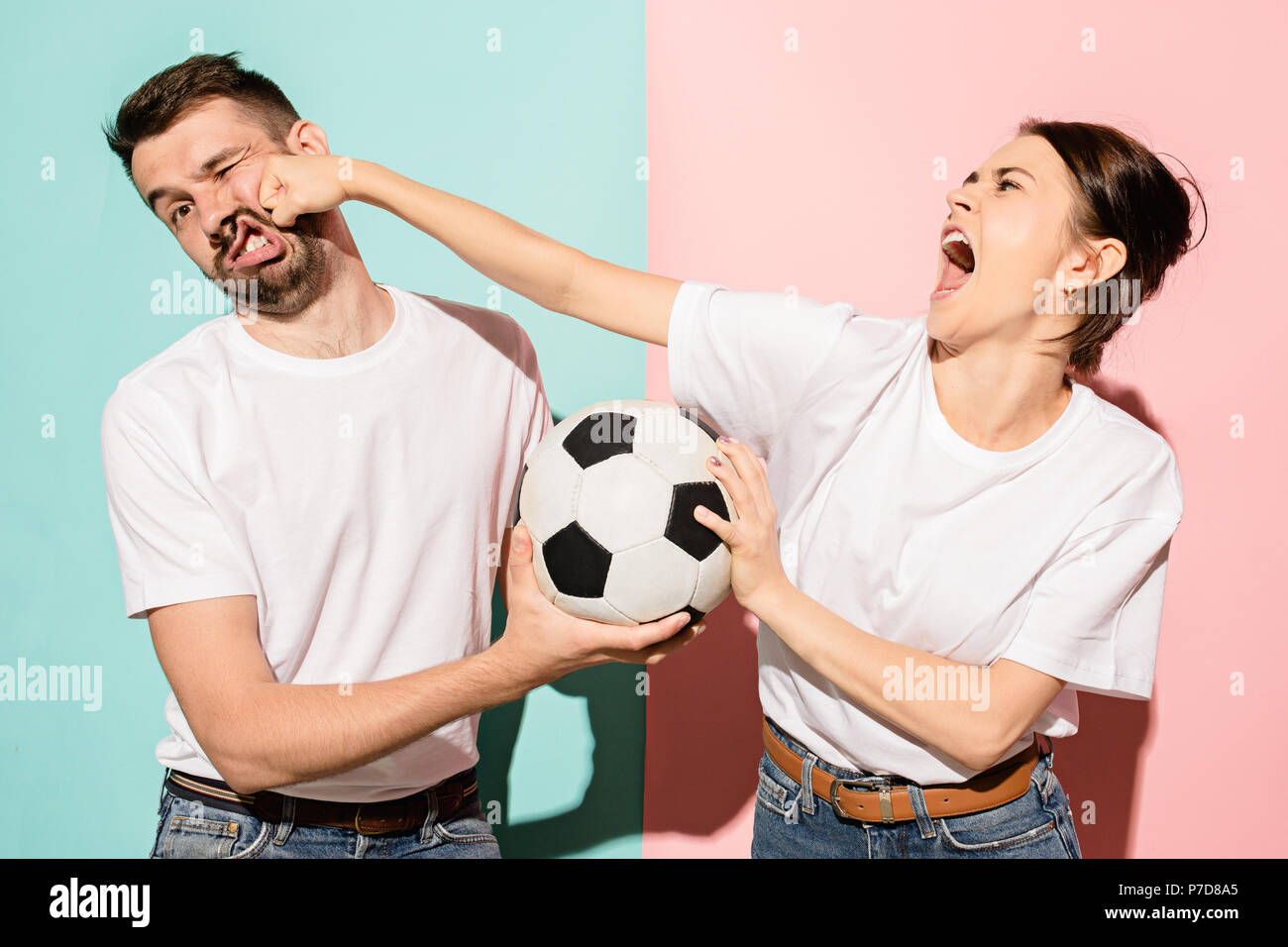 The unhappy and angry fans on colored blue and pink background Stock ...